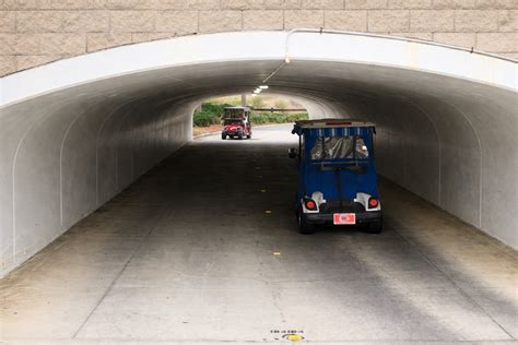 Interior View Of The Villages Golf Cart Tunnel With Two Carts Traveling