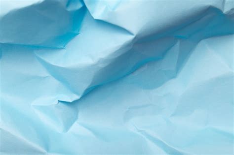 자세한 구겨진 종이의 질감 또는 배경 프리미엄 사진