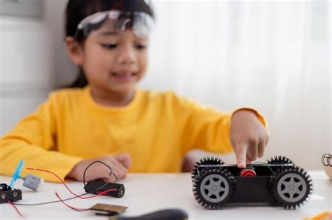 Premium Photo Asia Students Learn At Home In Coding Robot Cars And