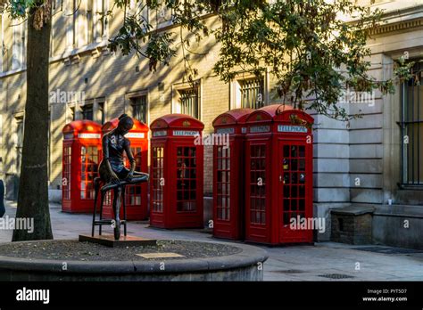 5 Red Telephone Boxes And Sculpture In Covent Garden London England