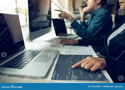 Two Software Developers Are Analyzing Together About The Code Written Into The Program On The