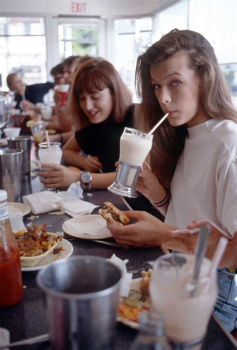 A Young Milla Jovovich Having A Burger And Milkshake At Johnny Rockets