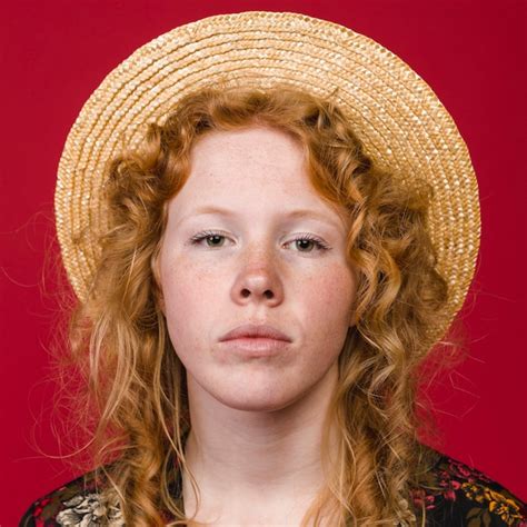 Free Photo Redhead Woman Looking At Camera