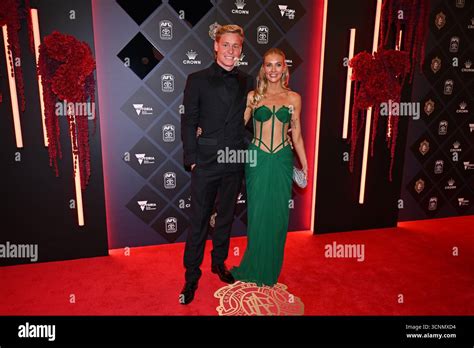 Isaac Heeney Of The Swans Left And Steffanie Waters Pose For A Photo