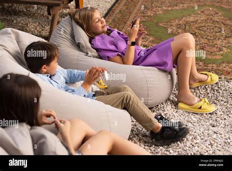 Friends Drinking Lemonade Together In A Garden Party Celebration