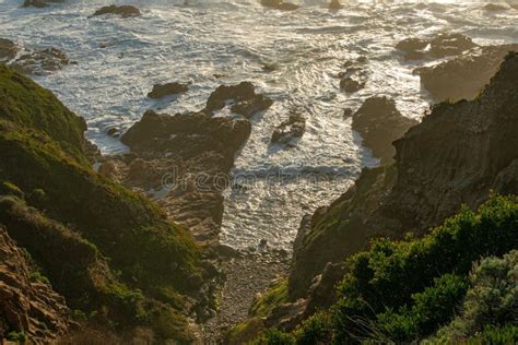 Scenic View Of A Cliff Overlooking The Pacific Ocean With The Sun