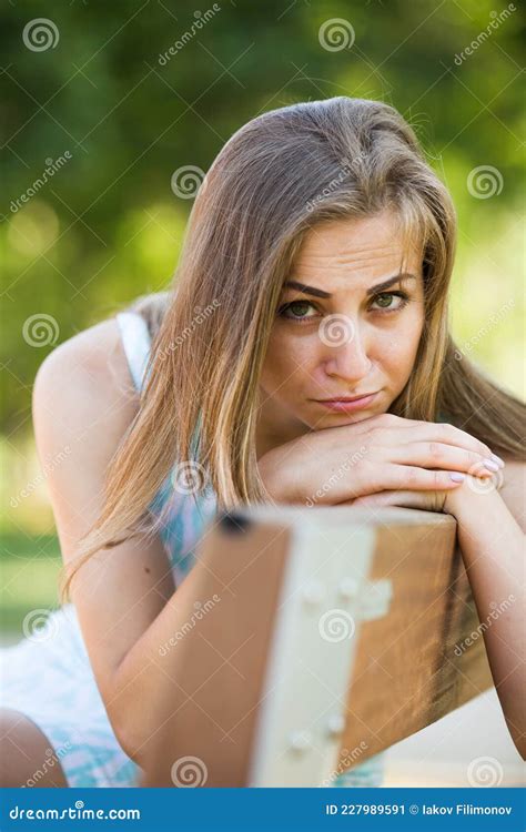 Portrait Of Sad Girl Sitting On Bench Outside Stock Image Image Of