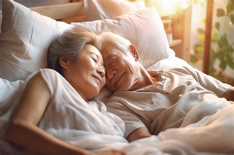 Premium Photo An Elderly Asian Man And Woman Are Seen Laying Together