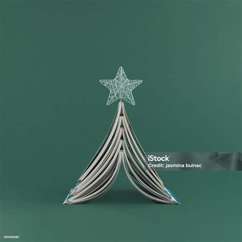 2022 최소한의 추상적 인 새해 출판사는 녹색 배경에 고립 된 책과 실버 스타로 만든 크리스마스 트리와 함께 배치합니다 인사말 카드 또는 기프트 카드 컨셉 크리스마스에