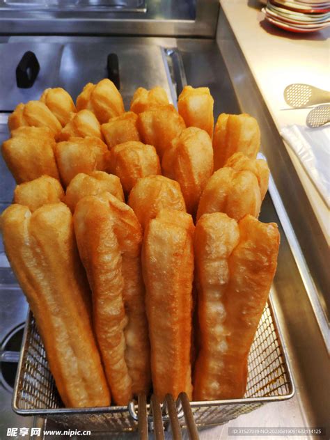 美食小吃油条摄影图 传统美食 餐饮美食 摄影图库 昵图网