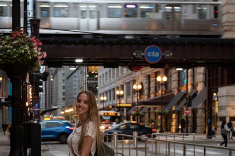 Girl With Backpack And Camera On Summer Vacation In Chicago At Sunset