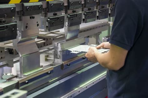 Operation Of Press Brake Hydraulic Bending Machine With Forming Die By Skill Operator Stock