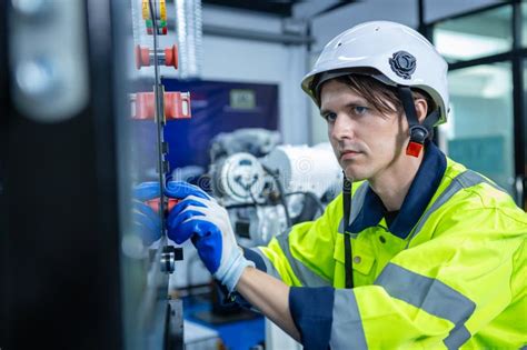 Man Engineer Using Computer Controlling Machine Automation Robotics At