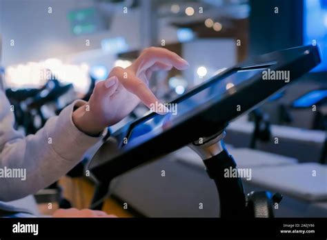 Woman Hand Using Touchscreen Display Of Floor Standing Black Tablet Kiosk Stock Photo Alamy