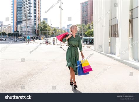 Smiling Mature Woman Carrying Shopping Bags Stock Photo Shutterstock