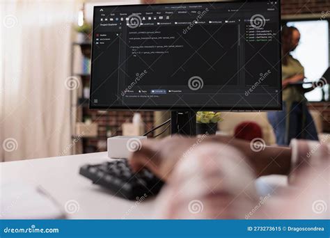 Closeup Of African American Programmer Writing Code On Personal