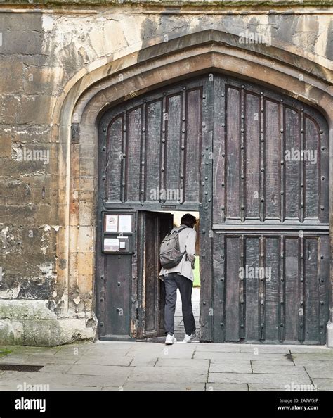 A Male Student Passes Through The Door To New College University Of