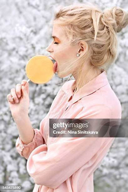 Blonde Girl Licking Side View Photos And Premium High Res Pictures