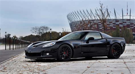Download Caption Pristine Chevrolet Corvette C6 Zr1 Parked Wallpaper