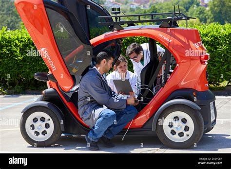 twizzy electric vehicle researchers work in two electric cars the