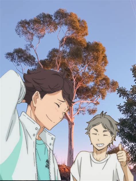 Two People Standing Next To Each Other Near Trees