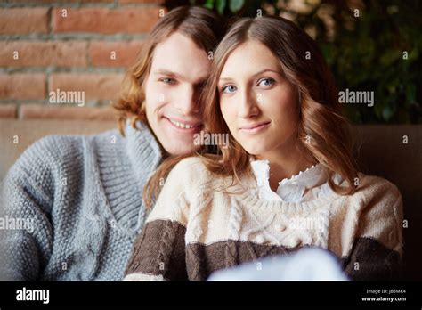 Portrait Of Amorous Young Couple Looking At Camera With Smiles Stock