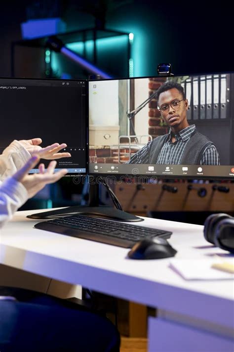 It Professional Working From Home In Videocall With Coworker Stock