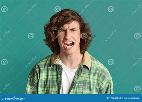 Expressing Anger Young Guy With Furious Facial Expression On Color