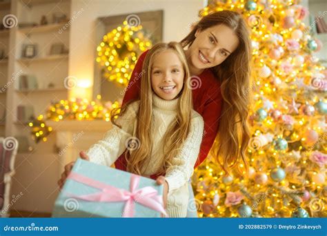 Blonde Cute Girl And Her Mom Smiling And Looking Happy Stock Image