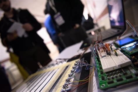 Premium Photo High Technology Electric Circuit Motherboard With Team Of Computer Engineers In