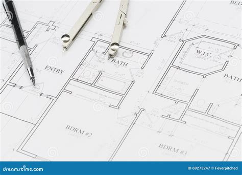 A Compass On The Top Of The Residence Floorplan Royalty Free Stock