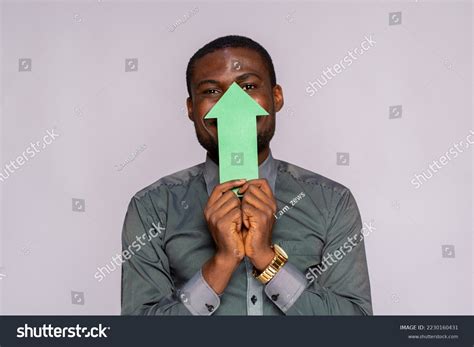 Black Man Holding Arrow Pointing Upwards Stock Photo Shutterstock