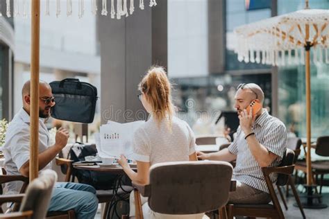 Startup Team Having A Business Meeting Outdoors Discussing Brainstorming And Strategizing Ideas