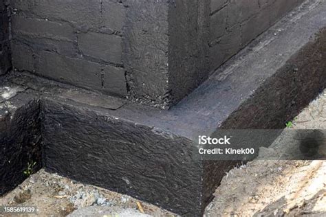 Footings Made Of Concrete Blocks Painted With Black Dispersion