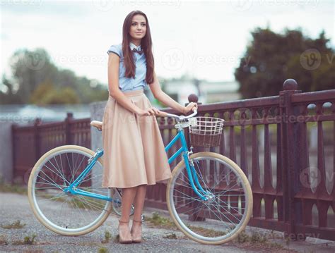 Young Beautiful Elegantly Dressed Woman With Bicycle 21094392 Stock
