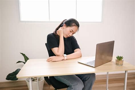 Premium Photo Young Female Student Suffering Neck Pain While Working