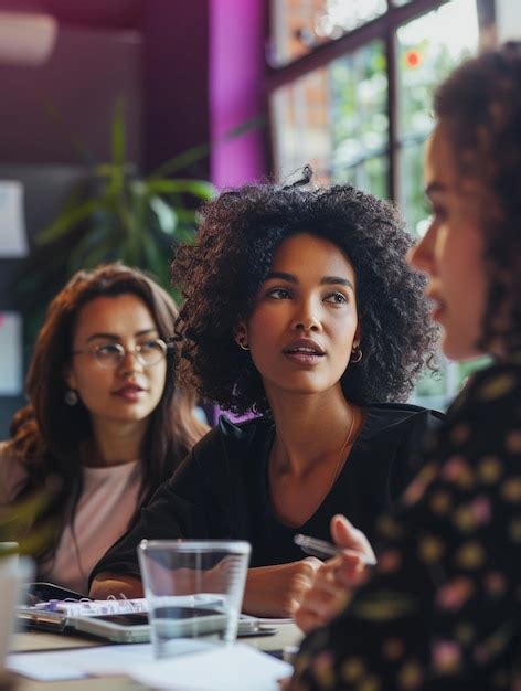 Collaborative Team Meeting In Modern Office Setting Premium Ai Generated Image