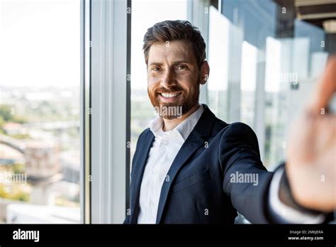 Happy Middle Aged Businessman Having Video Call Or Taking Selfie While