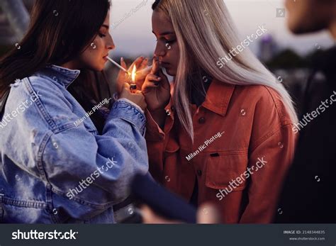 Young People Smoking Cigarettes