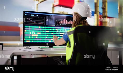 Female Engineer Using Scada System Control Panel At Export Port Stock