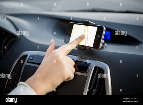 Female Driver Using Touchscreen Smartphone With GPS Navigation Stock Photo Alamy