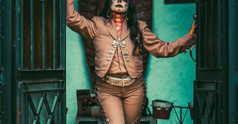 Calavera Catrina In A Beige Charro Suit Standing In The Doorway · Free