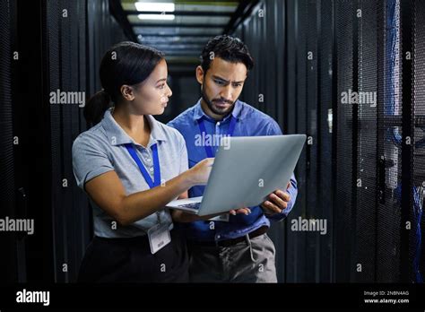laptop server room and technician people problem solving in database