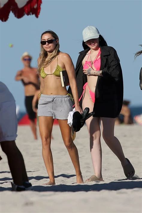 Noah Cyrus Hits The Beach In Bright Pink Bikini And Comfy Yeezy Slides