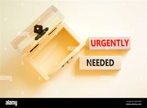 Urgently Needed Symbol Concept Words Urgently Needed On Wooden Blocks On A Beautiful White