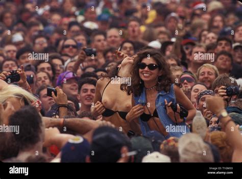 A Concert Goer Is Shown Flashing In The Crowd At Woodstock 94 In