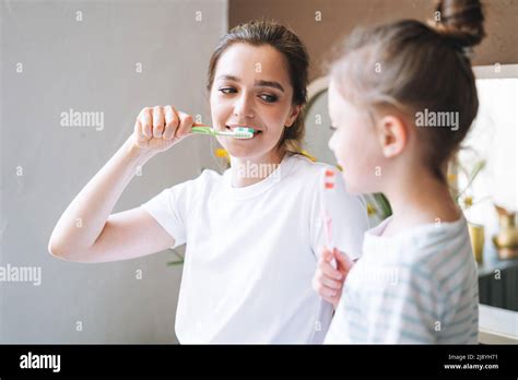 Young Mother Woman With Long Hair With Little Tween Girl Daughter In