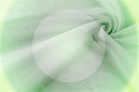 직물의 질감 배경입니다 배경으로 녹색 실크 직물 실크 또는 공단 부드러운 우아한 그린을 사용할 수 있습니다 녹색 추상적인 직물 배경 또는 액체 파도 곡선에 대한 스톡 사진