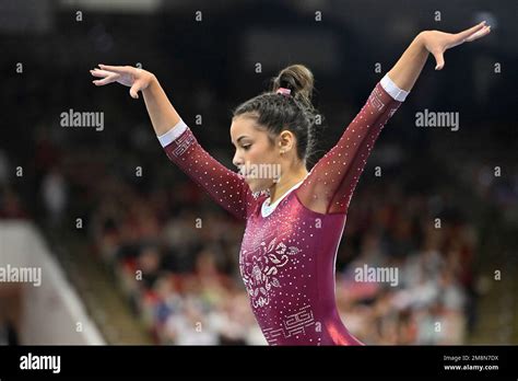 Alabama Gymnast Ella Burgess Competes On The Beam Against Arkansas During An Ncaa Gymnastics