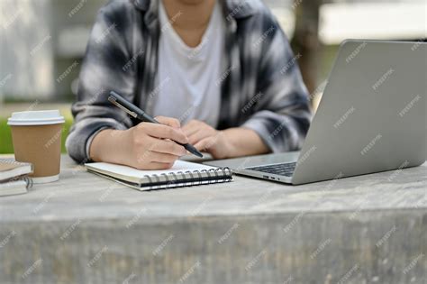 Premium Photo A Female College Student Doing Her Homework Or School